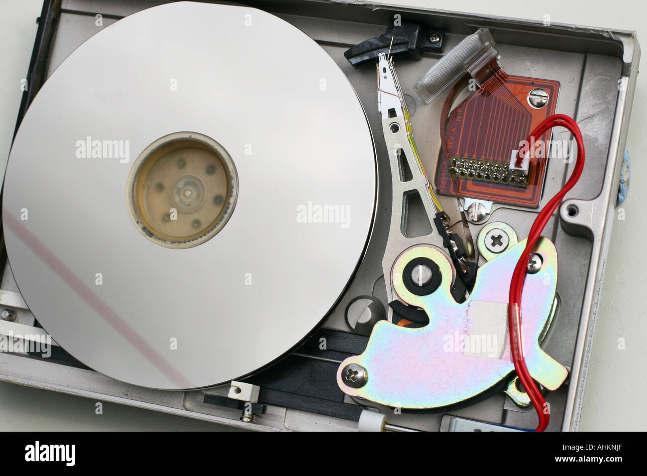 Shot of surface of computer hard disk with magnetic reading arm in ...