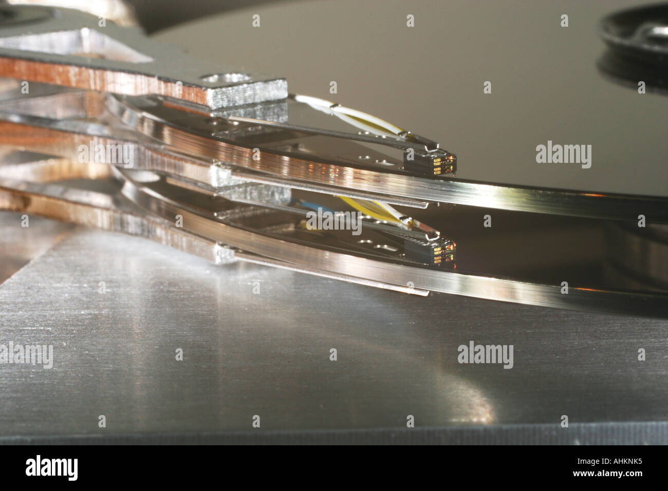 Very close shot of hard drive read write heads on the disk Stock Photo ...
