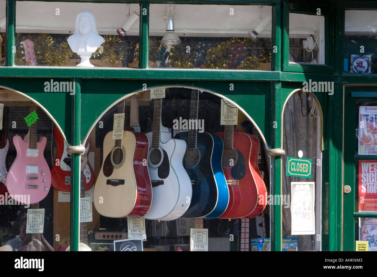 Music shop window showing guitars and other musical instruments Stock ...