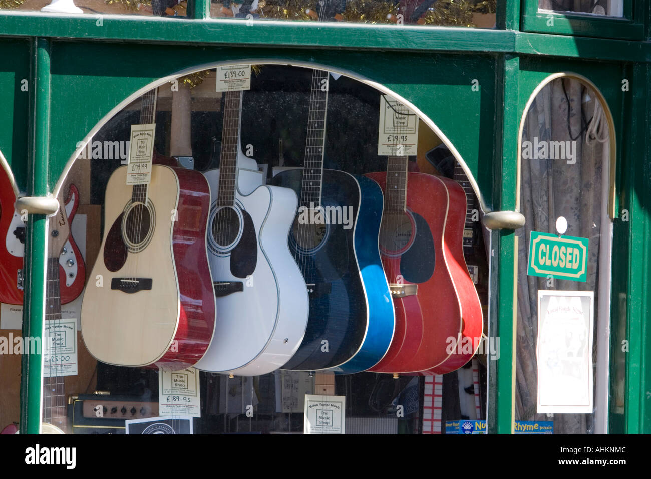 Music shop window showing guitars and other musical instruments Stock ...