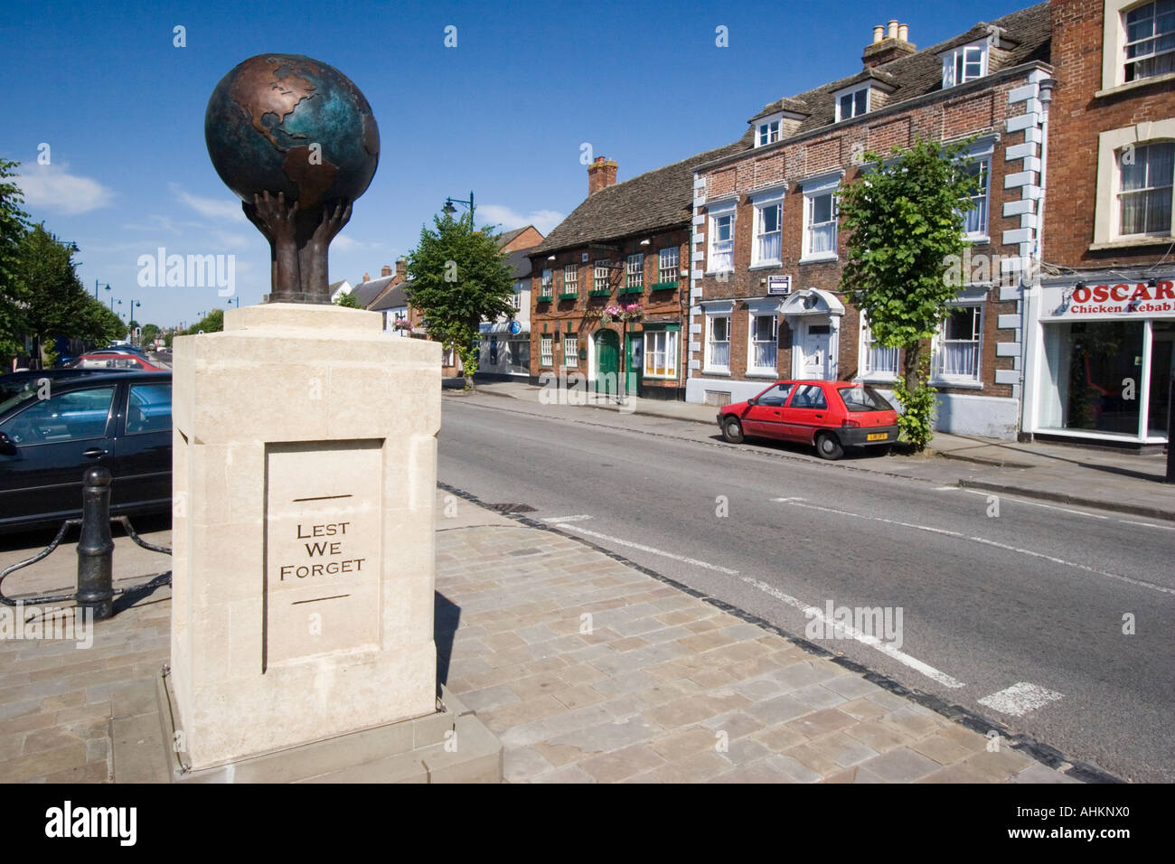 A bronze globe on stone plinth the war memorial in Wootton Bassett High ...