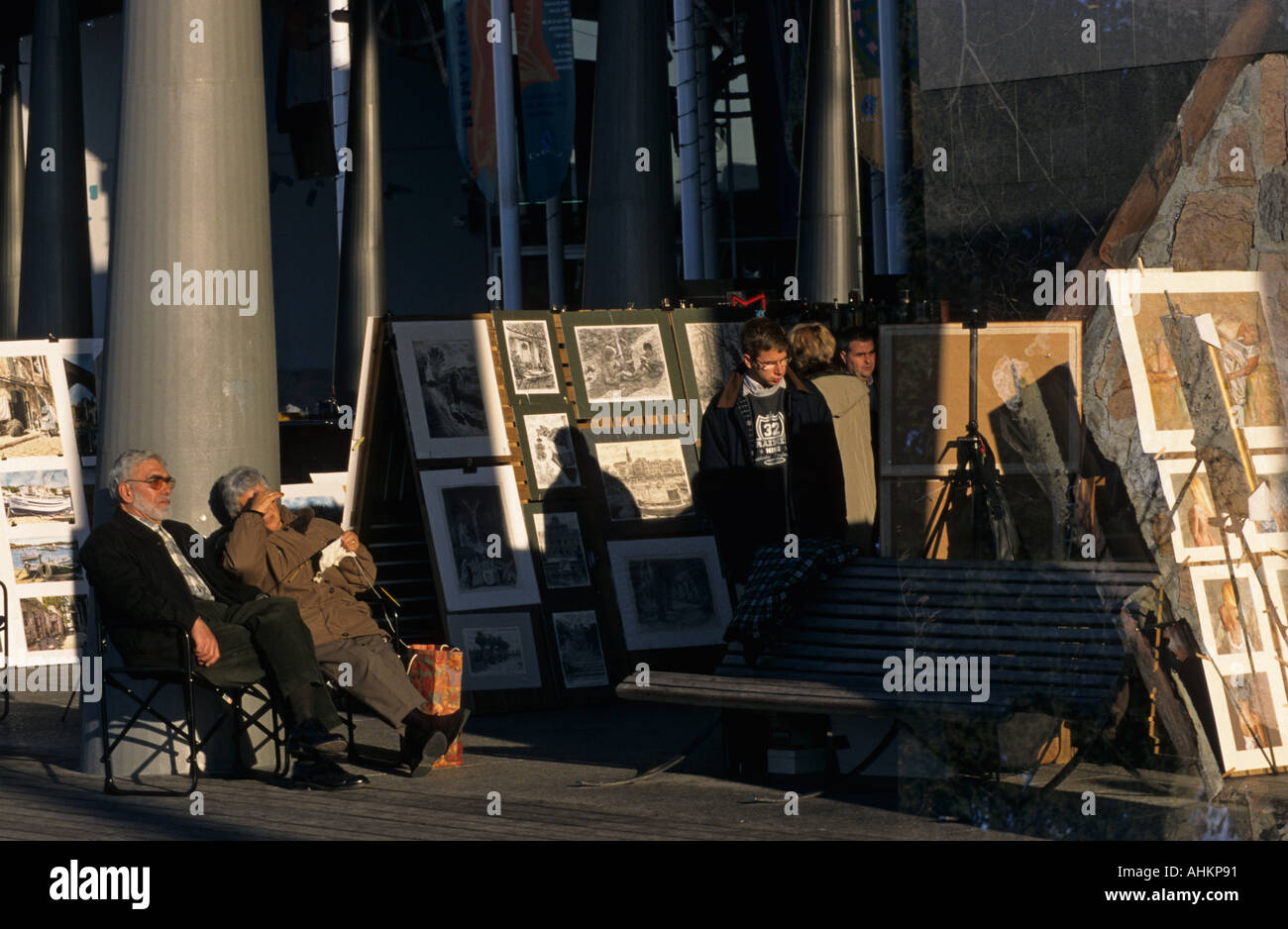 people watching at an open air painting exhibition Maremagnum Barcelona ...