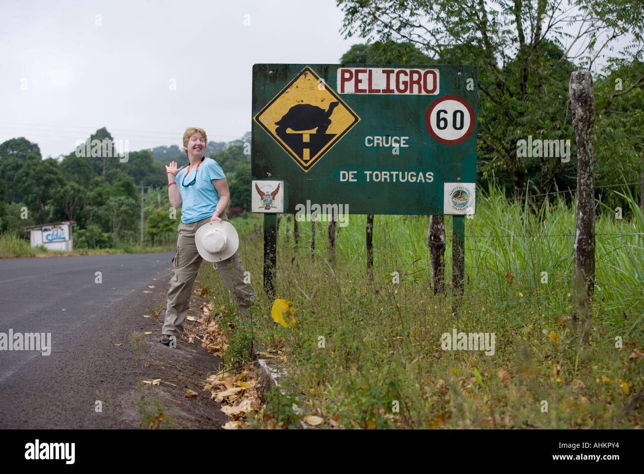 Ecuador Galapagos Islands Tourists pose for snapshots in front of ...