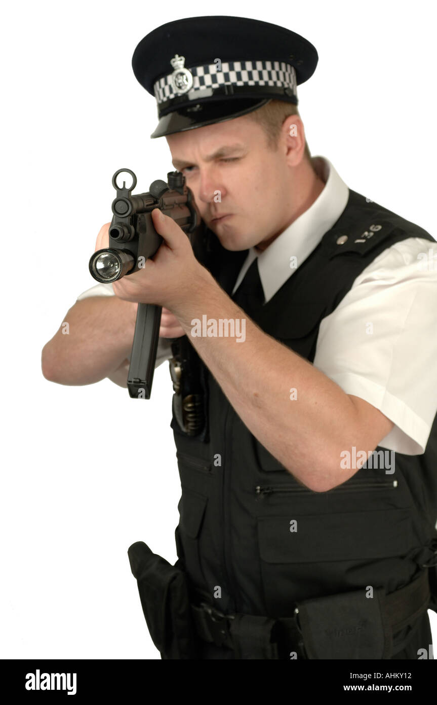 an armed police officer in uniform with a heckler kock MP5 automatic ...