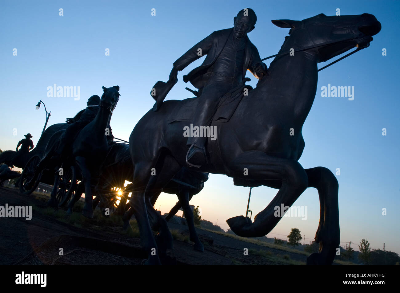 Oklahoma Land Run Monument along the Bricktown canal at sunrise ...