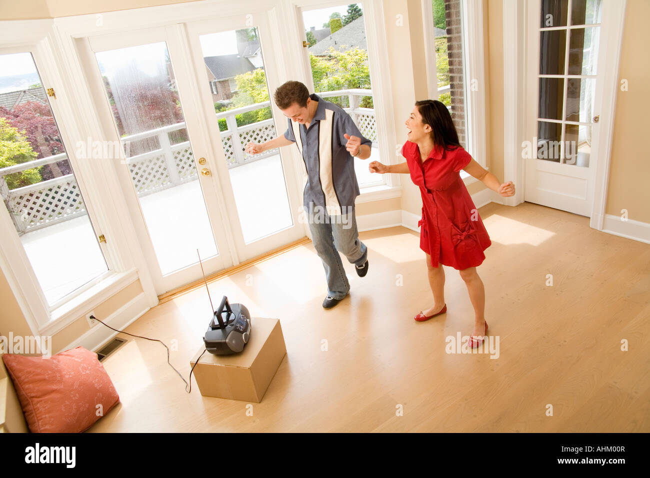 Couple dancing in new house Stock Photo - Alamy