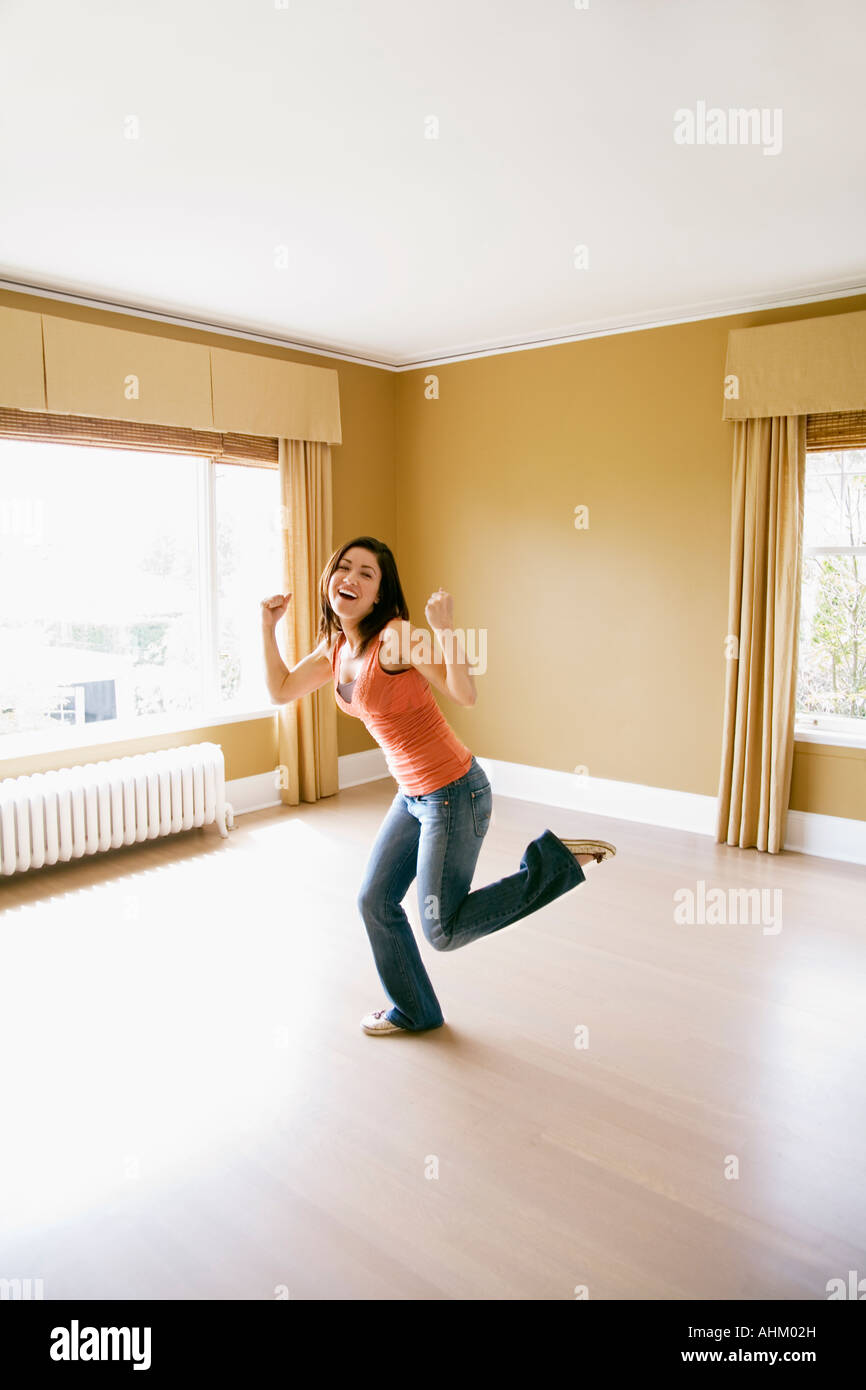 Woman dancing in new house Stock Photo - Alamy
