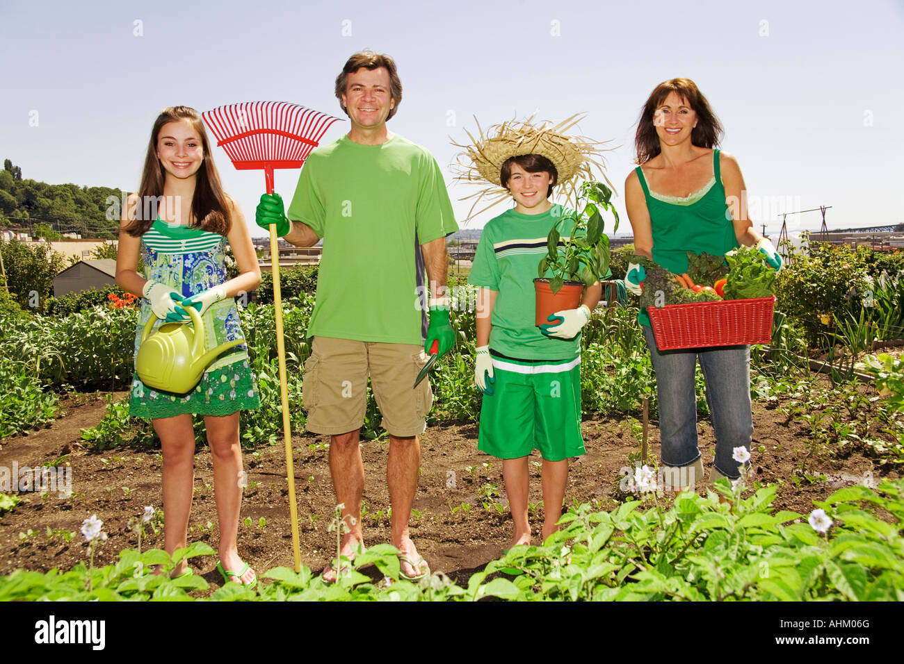 Family in vegetable garden Stock Photo - Alamy