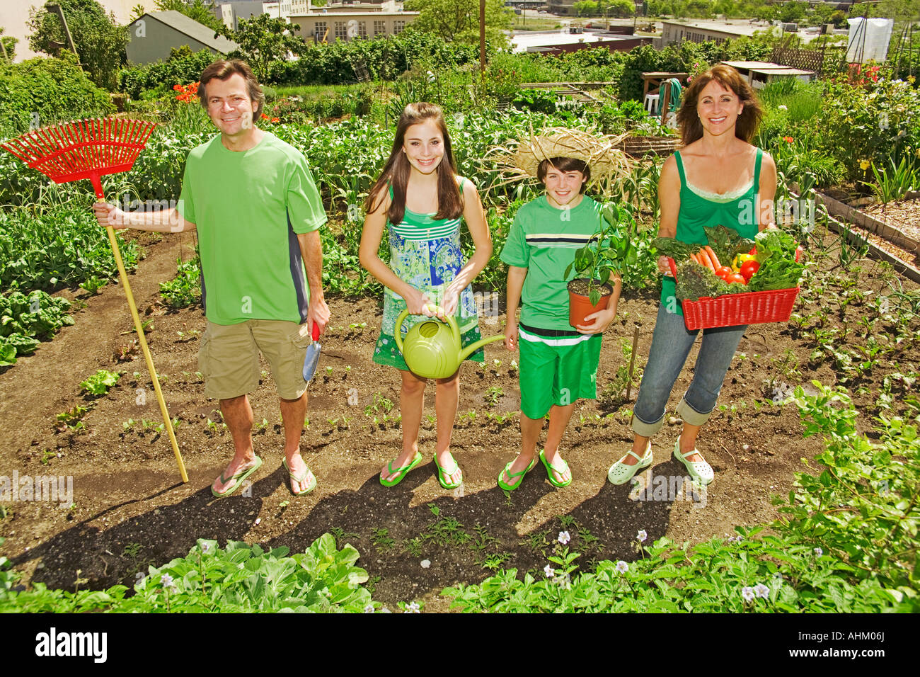 Family in vegetable garden Stock Photo - Alamy