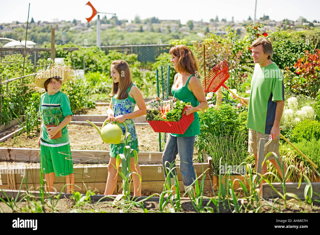 Family in vegetable garden Stock Photo - Alamy