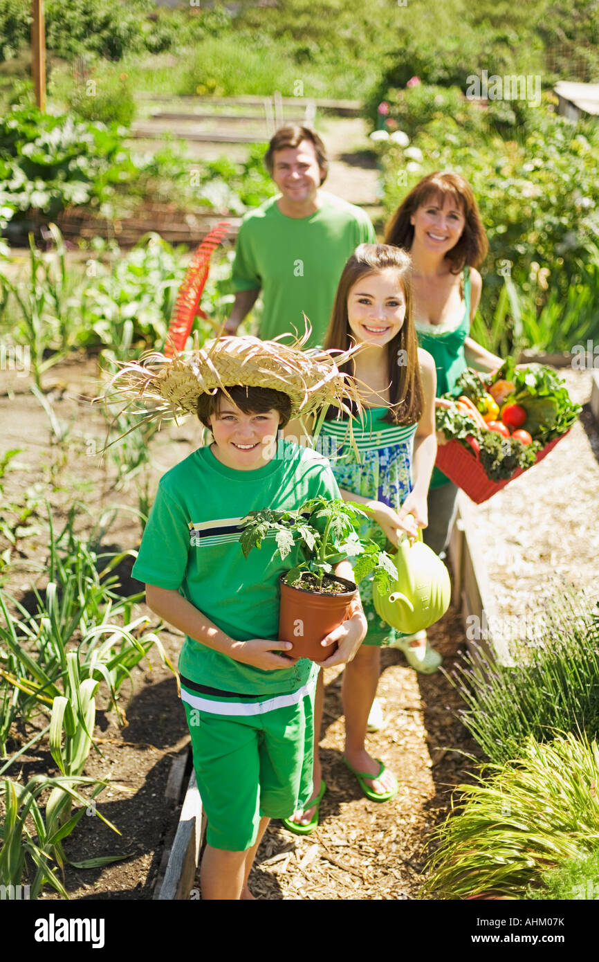 Family in vegetable garden Stock Photo - Alamy