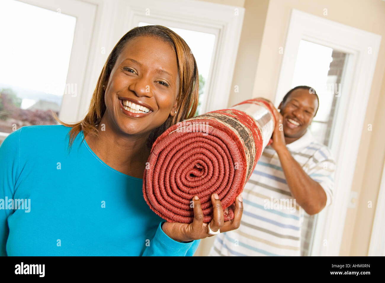 Couple carrying rug hi-res stock photography and images - Alamy
