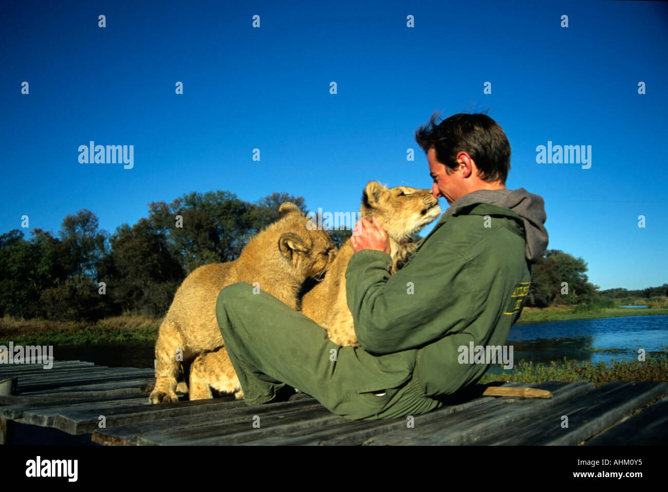 Man and lion Stock Photo - Alamy