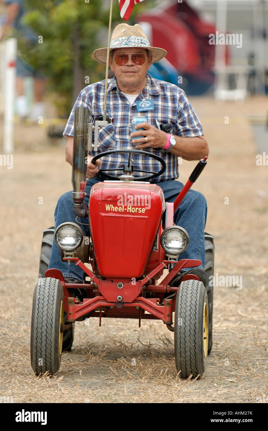 Man riding a small tractor "Antique Gas and Steam Engine Museum" Vista ...