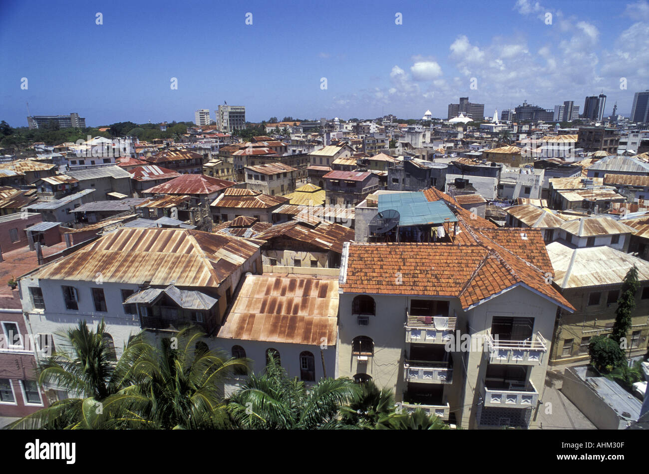 The roofs of the old town with the new modern high rise tall buildings ...