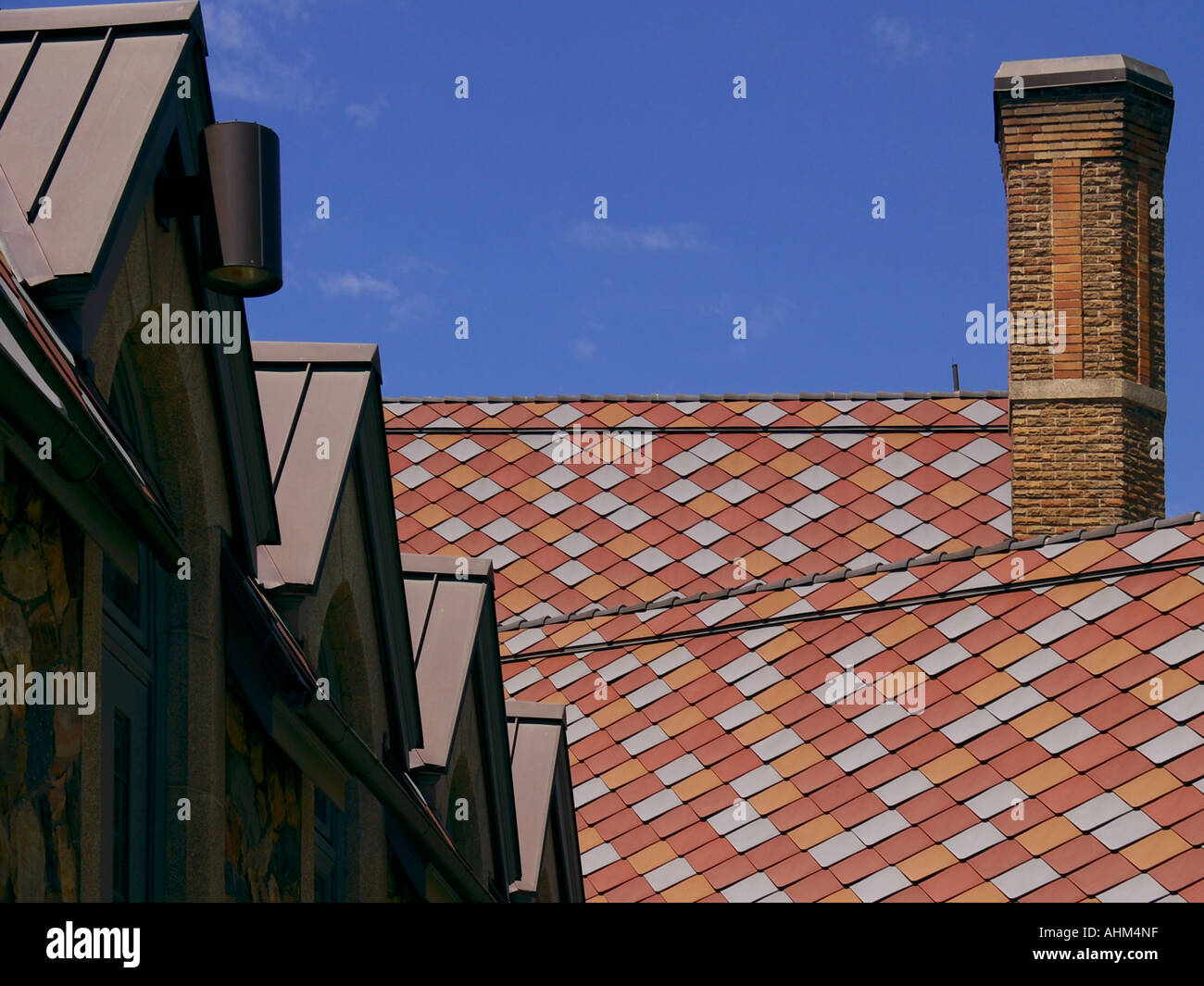 Colorful slate shingle roof on the gables and eaves of an old building ...