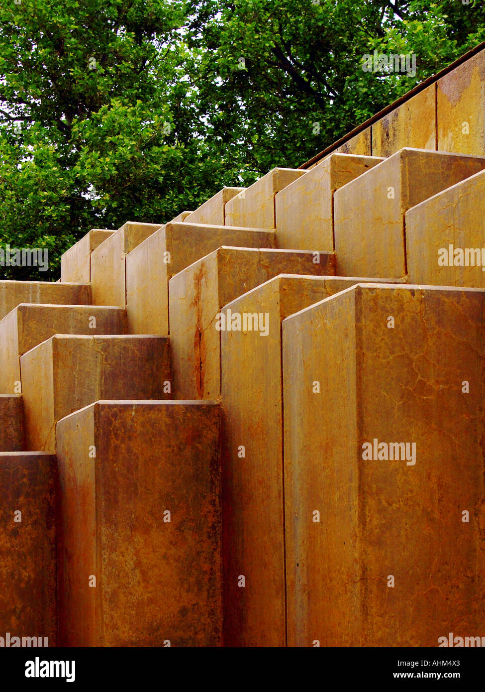 Poured concrete formed into large, unique, towering geometric forms and ...
