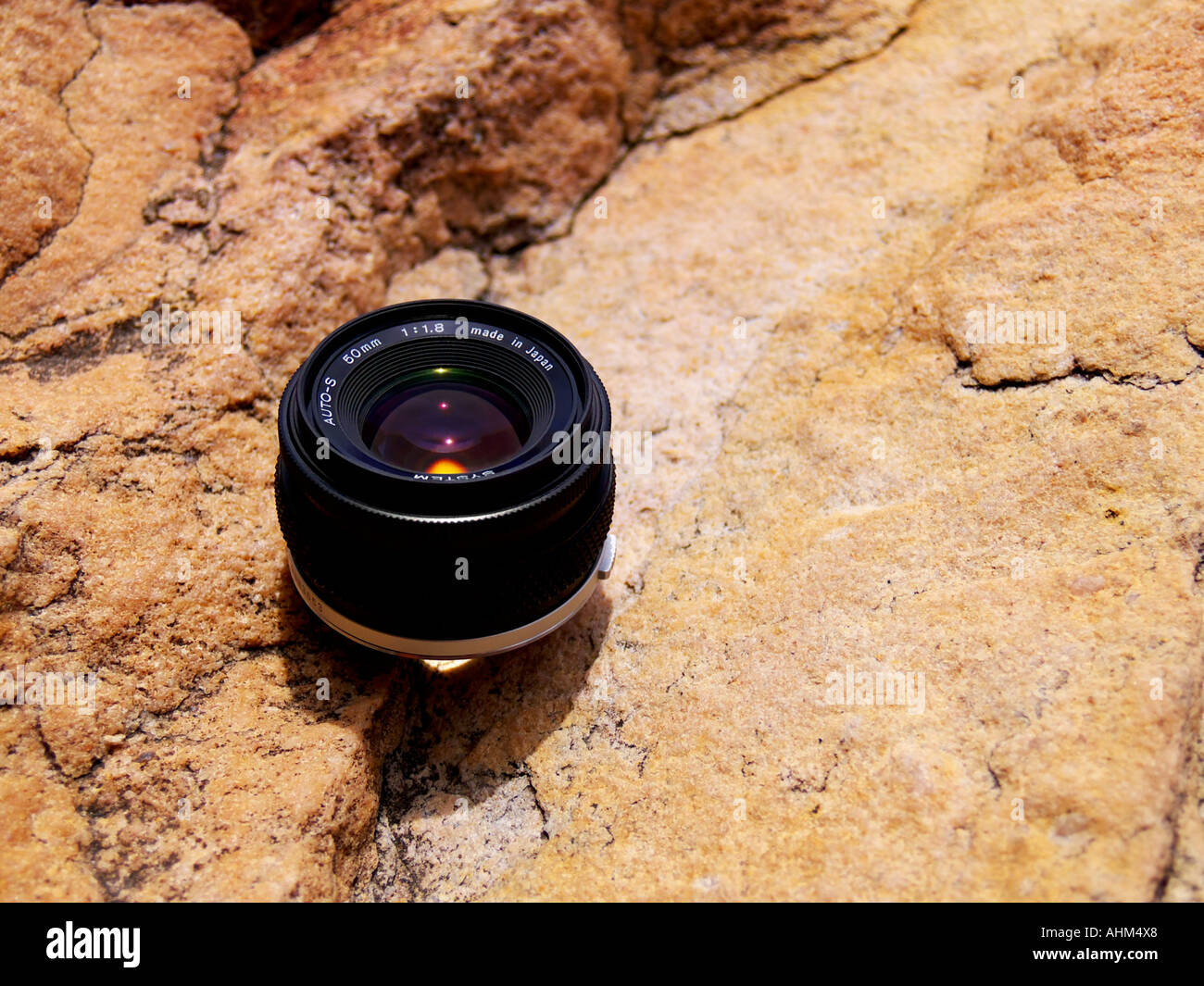 Shiny 50mm normal lens for photography in bright sunlight on sandstone ...