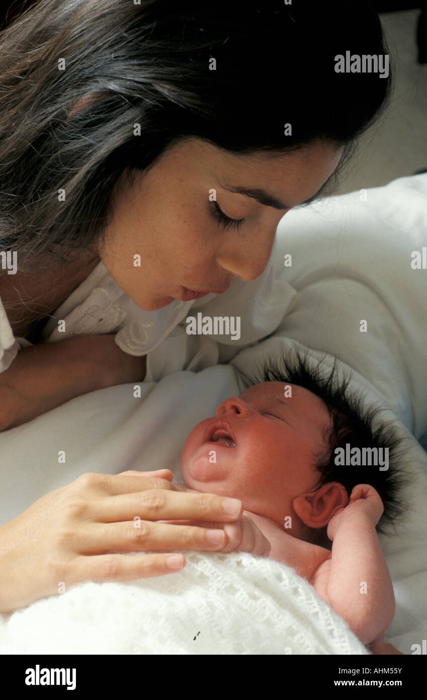 anglo-asian mother consoling her screaming newborn baby Stock Photo - Alamy