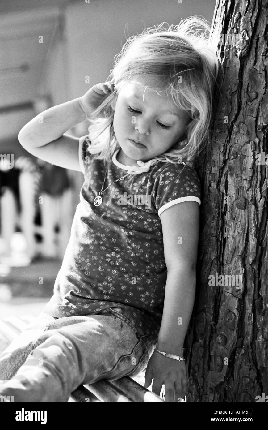 little girl having a quite moment, deep in thought Stock Photo - Alamy