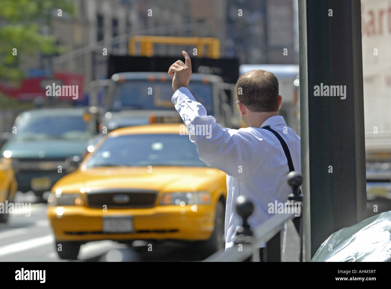 Man hailing yellow taxi cab New York city United States of America USA ...