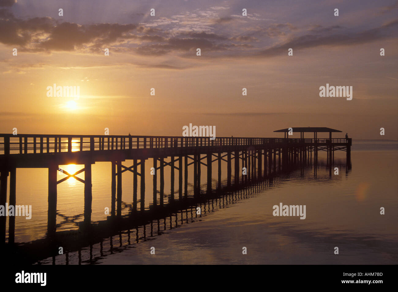 Sunrise Over Pier Stock Photo - Alamy