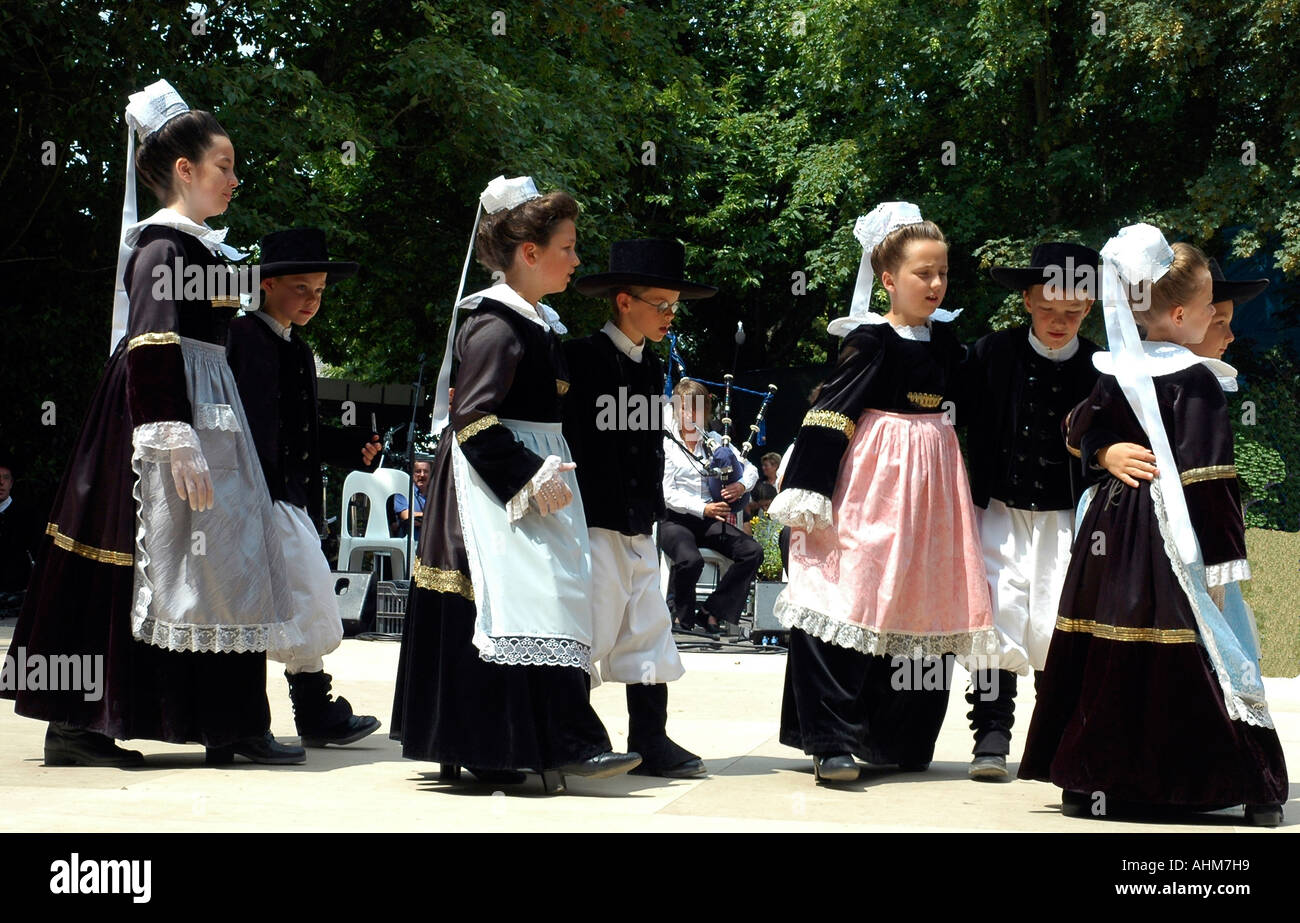 Wearing traditional costumes, Breton youngsters perform a folk dance ...