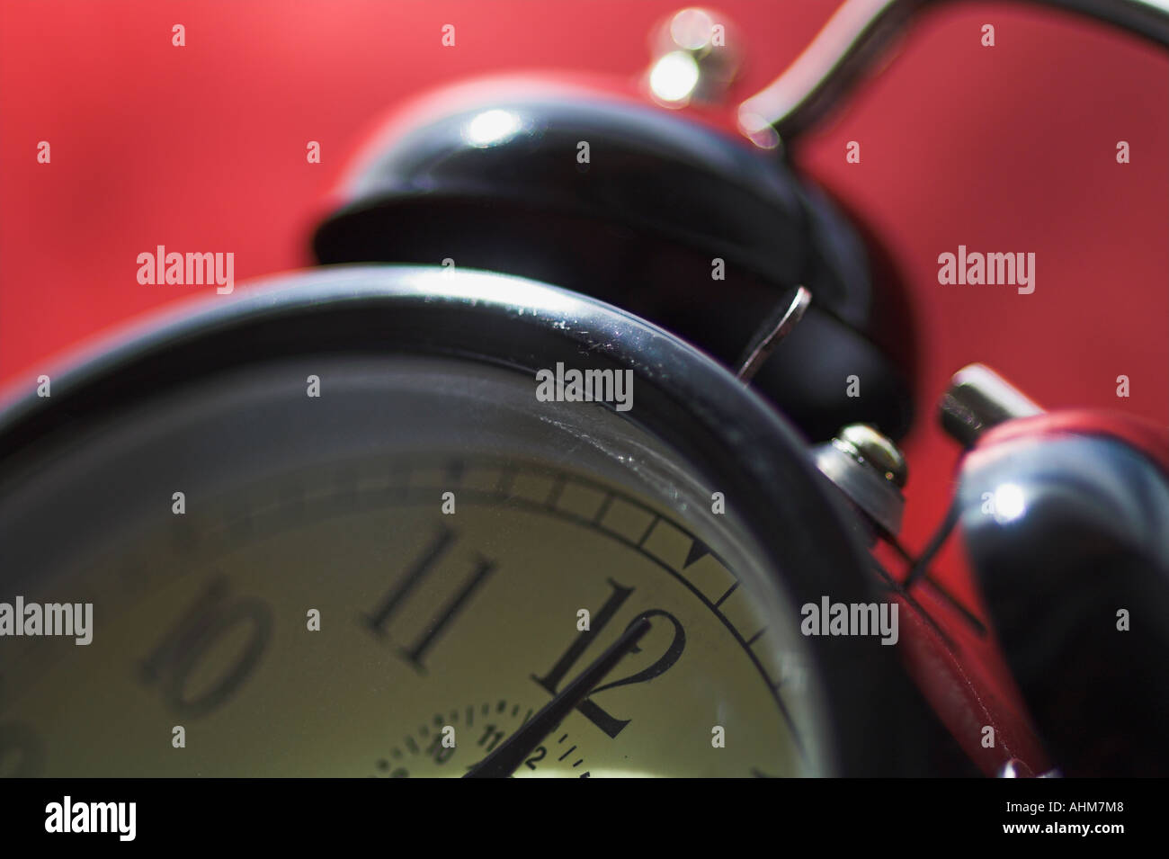 Close-up of clock with hands near 12 o'clock with sun light on the ...