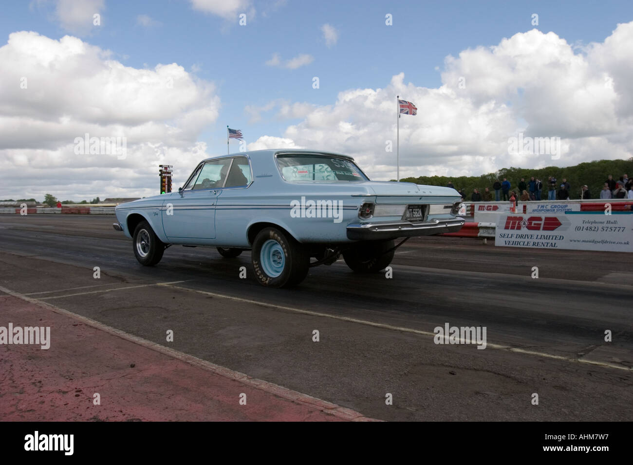 American muscle car on start line at drag race Stock Photo - Alamy