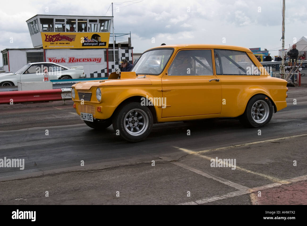 Heavily modified Hillman Imp leaving start line at drag race Stock ...