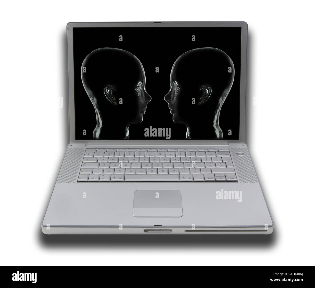 SILVER LAP TOP COMPUTER WITH TWO TRANSPARENT GLASS HUMAN HEADS ON ...