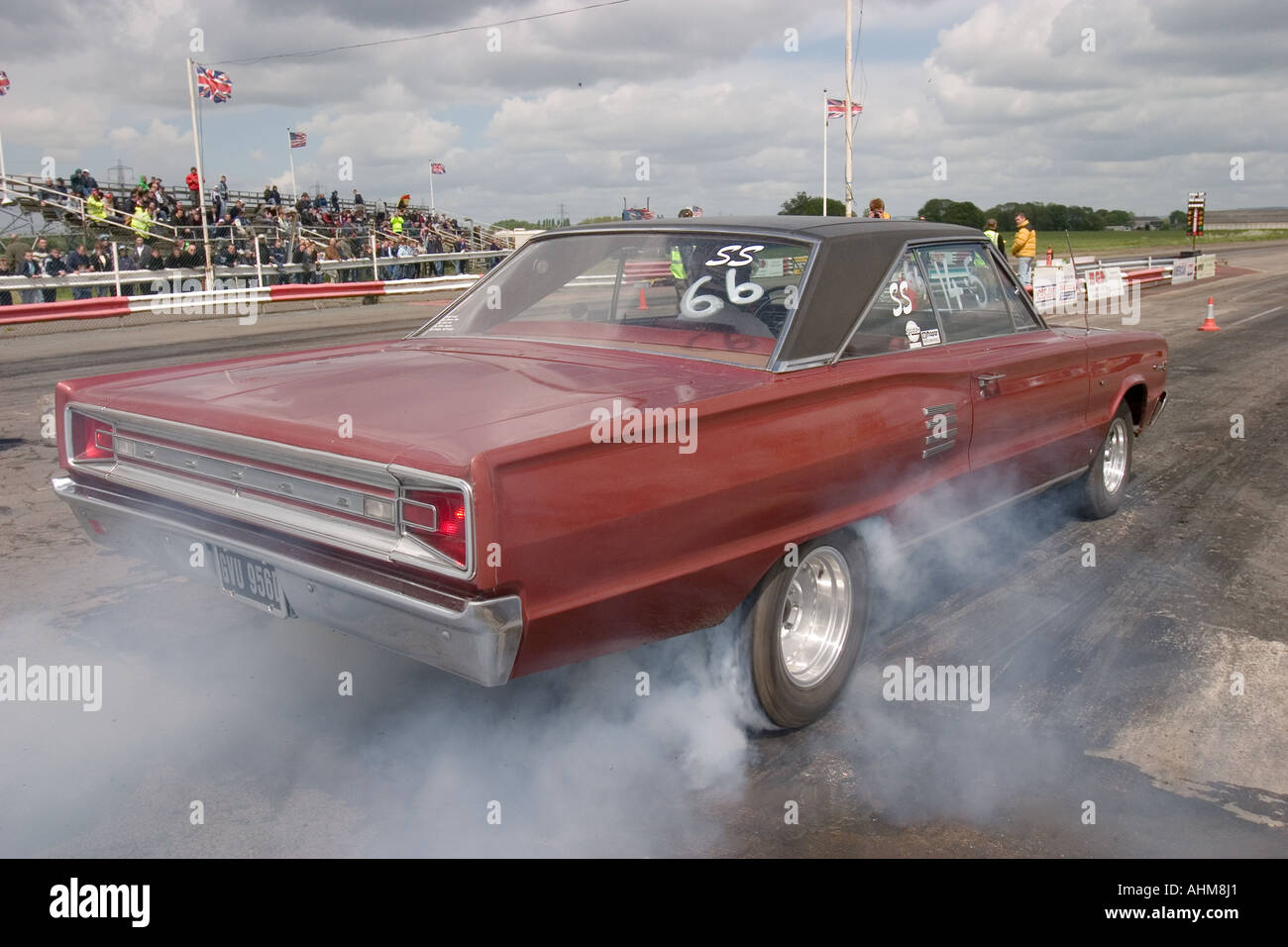 American muscle car doing burnout before start of drag race Stock Photo ...
