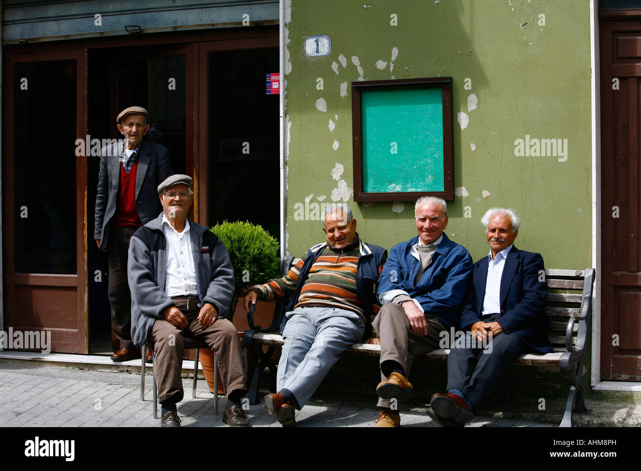 Local men sitting on a bench Sperlinga Sicily Italy Stock Photo - Alamy