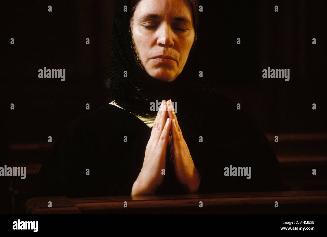 Woman church pew hi-res stock photography and images - Alamy