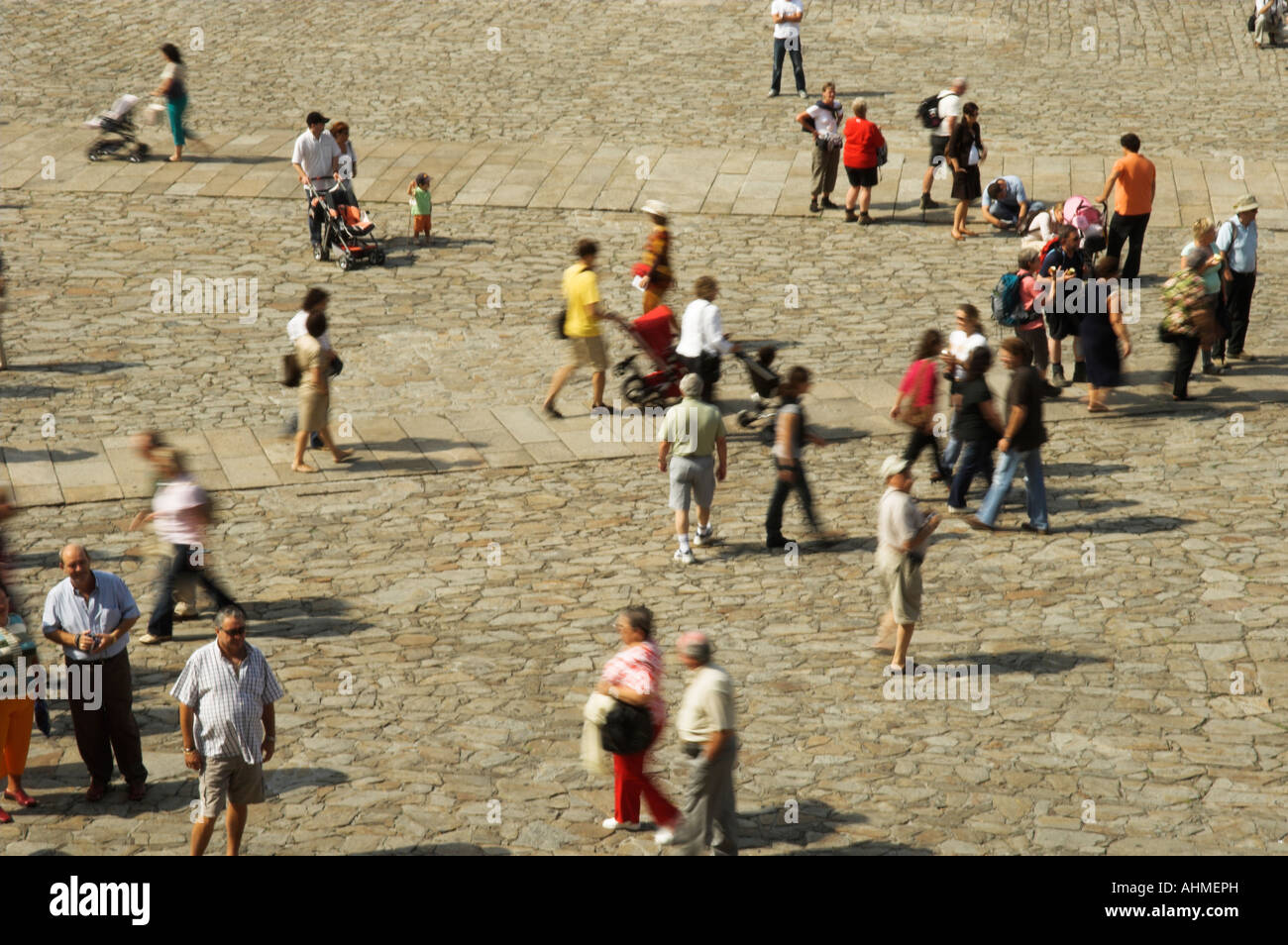 Crowd people standing walking moving in square Stock Photo - Alamy