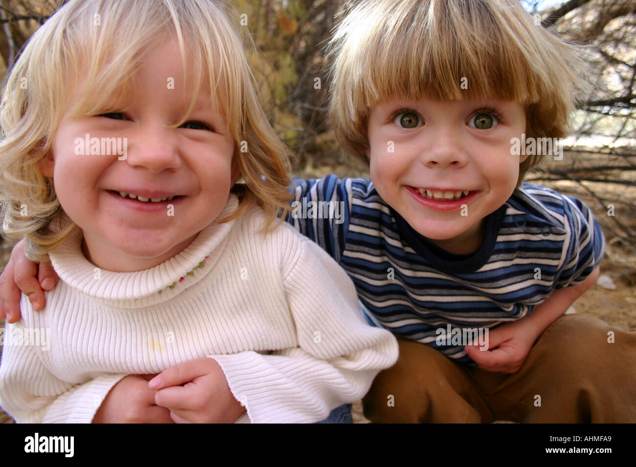 two young children smiling together Stock Photo - Alamy