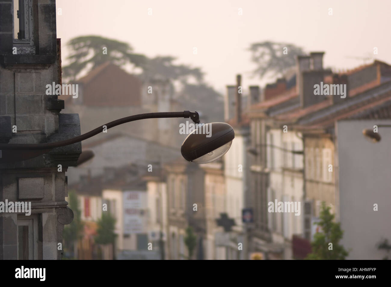 street light fixture over main street in Cognac France Stock Photo - Alamy
