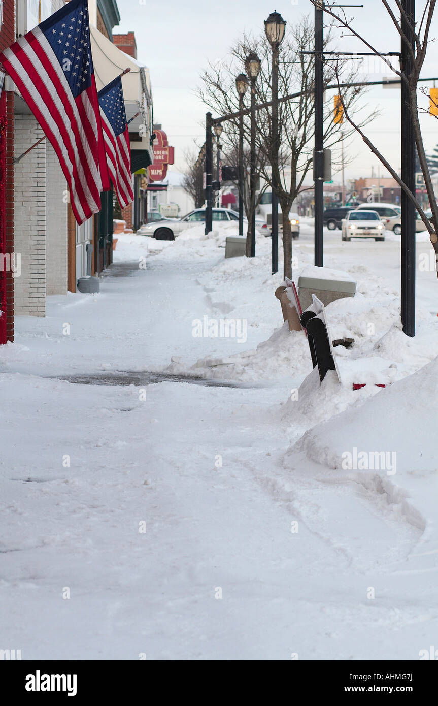 Snow covered sidewalks and roads in an American town Stock Photo - Alamy