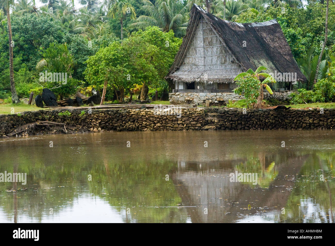 Traditional Stone Money or Rai in front of Faluw or Community House Yap ...
