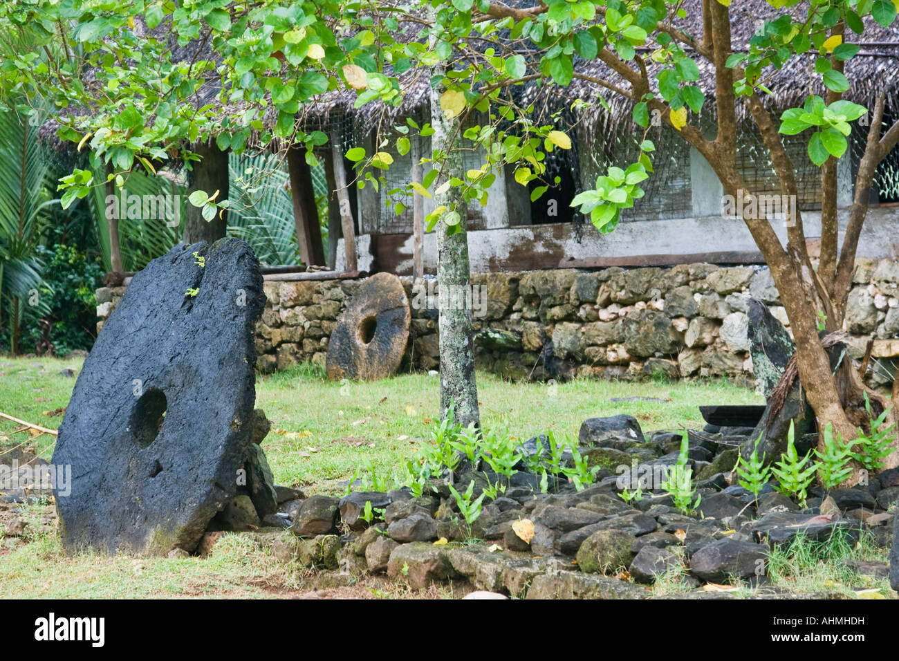 Traditional Stone Money or Rai in front of Faluw or Community House Yap ...