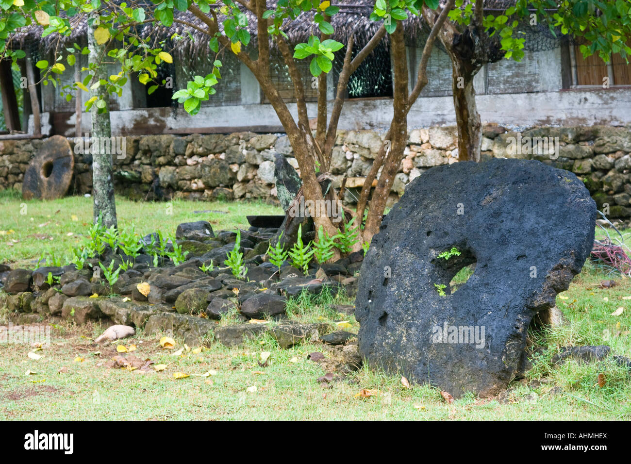 Traditional Stone Money or Rai in front of Faluw or Community House Yap ...