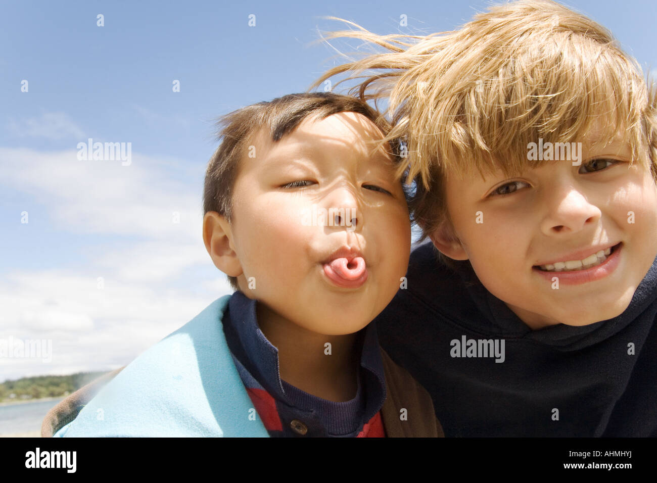 Boy making face next to friend Stock Photo - Alamy