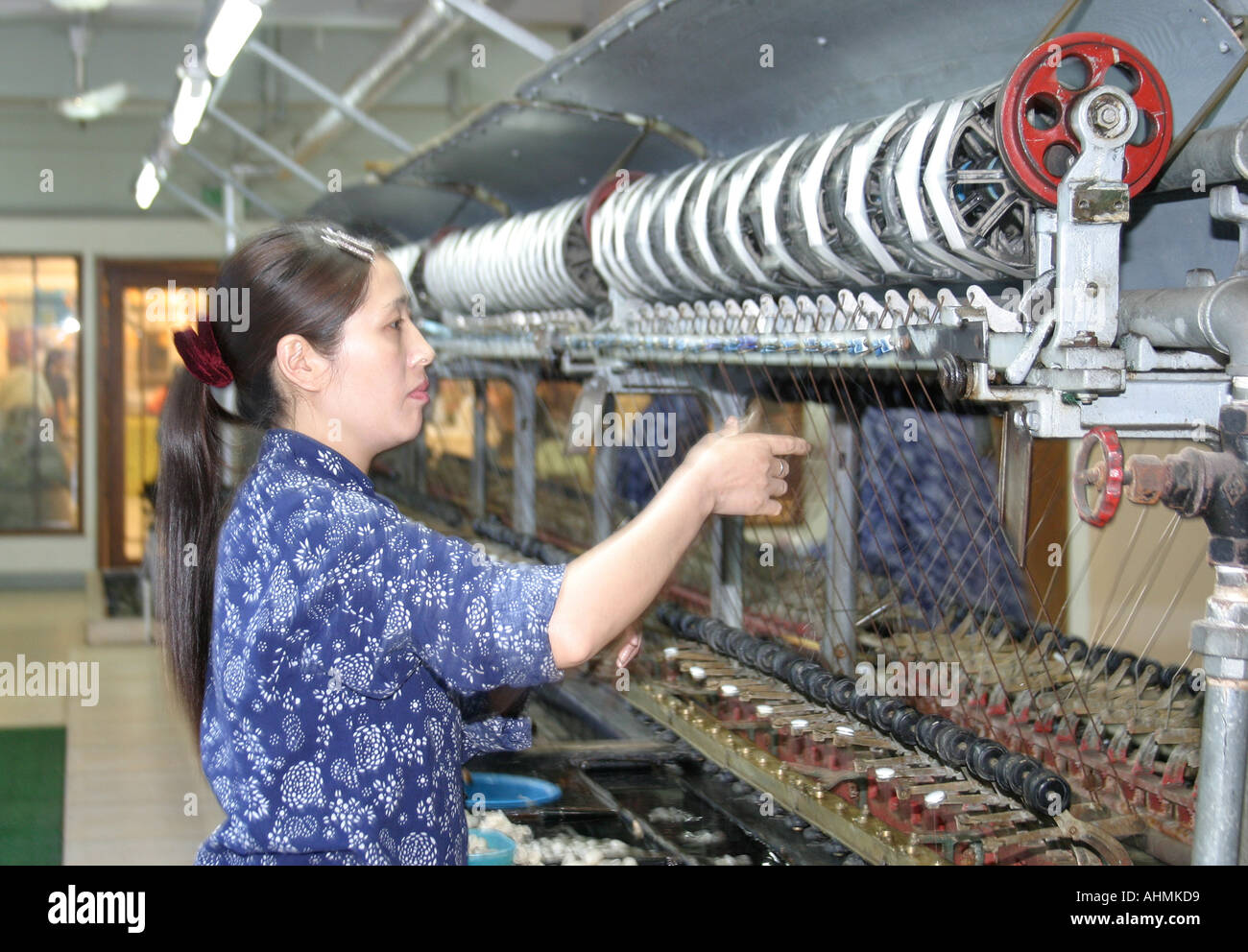 Female worker in a silk factory in Shanghai Stock Photo - Alamy