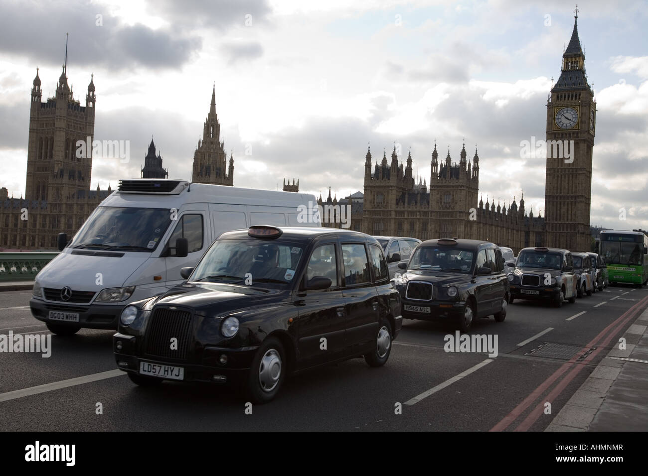 Stock photo of typical London Black cabs on Westminster Bridge with Big ...