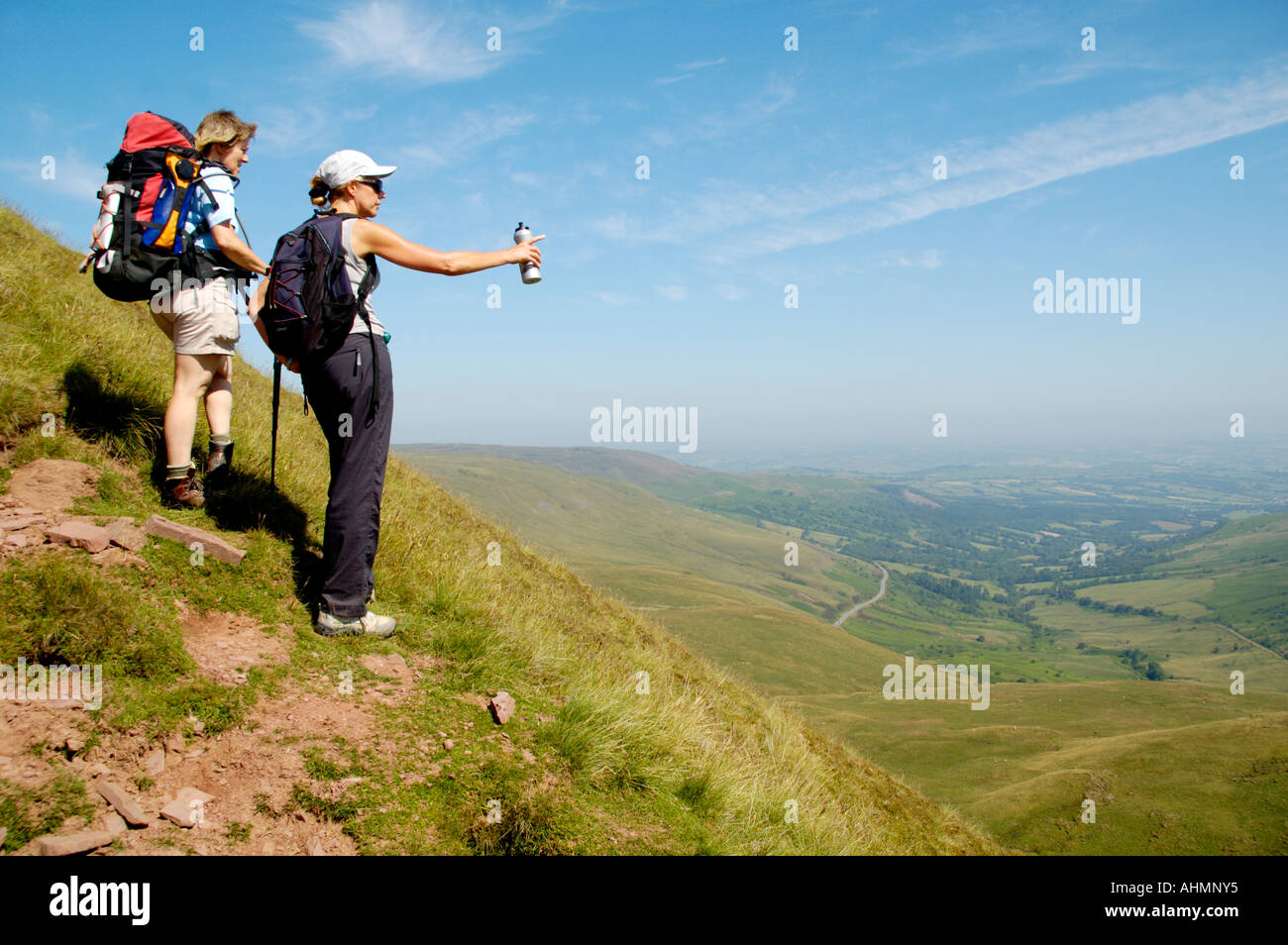 Guided walking group ascending Fan Fawr at Storey Arms in the Brecon ...
