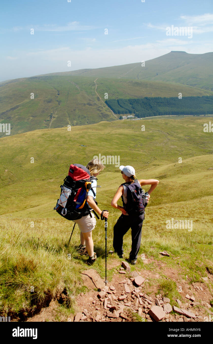 Women in guided walking group ascending Fan Fawr at Storey Arms in the ...