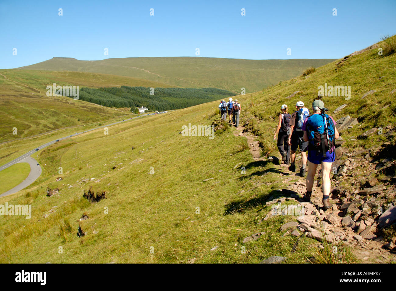 Guided walking group on hillside track heading toward Storey Arms in ...