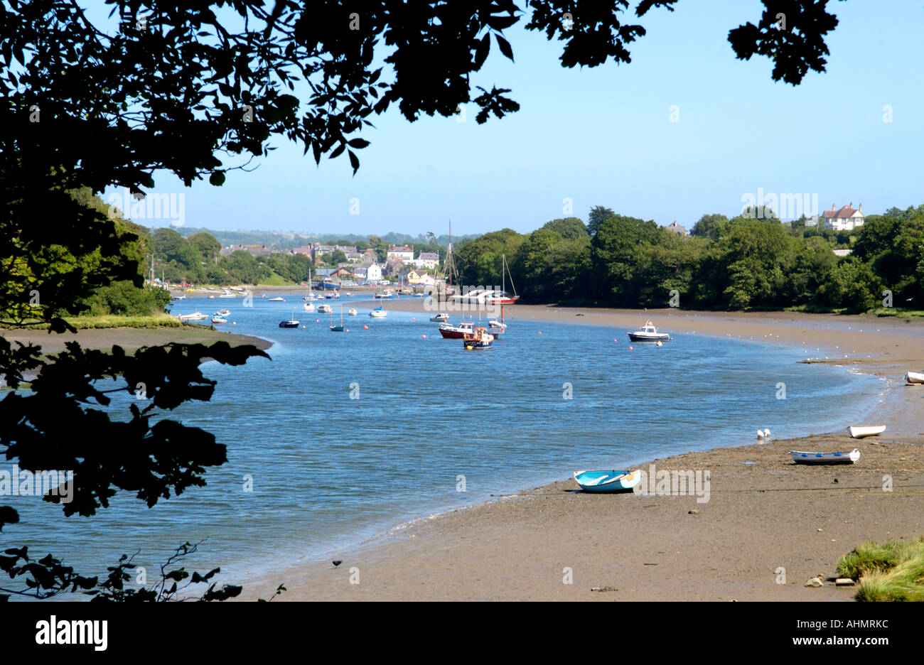 Boats moored in the River Teifi estuary looking upstream to Cardigan at ...