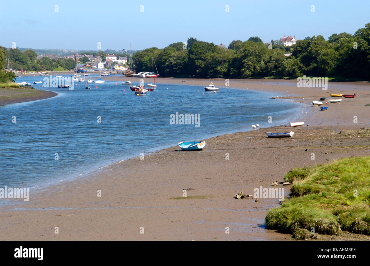 Boats moored in the River Teifi estuary looking upstream to Cardigan at ...