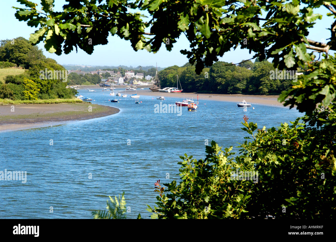 Boats moored in the River Teifi estuary looking upstream to Cardigan at ...